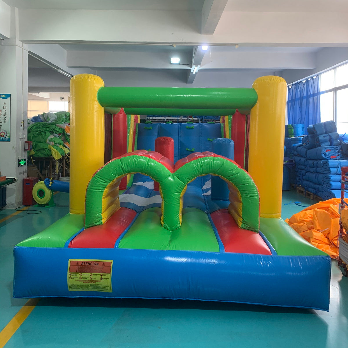 Commercial bounce house obstacle course with blower